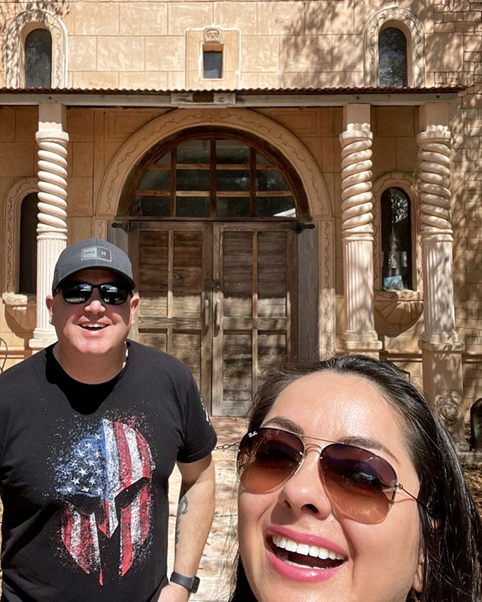 Happy explorers capture memories at the entrance, where even the most skeptical visitors can't help but smile at this monument to creative vision.