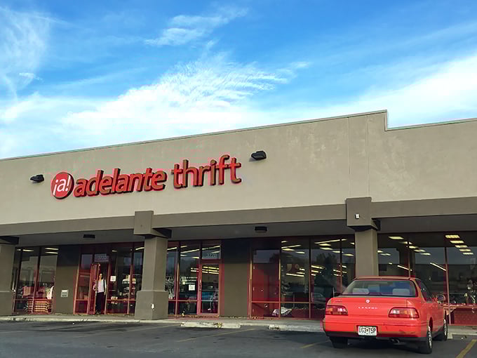 Adelante Thrift's bold red signage pops against the neutral building&mdash;as vibrant as the finds inside.