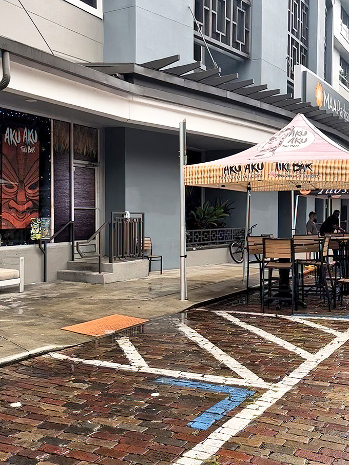 That red tiki face isn't judging you for ordering a drink with four kinds of rum at 2pm. He's encouraging it.