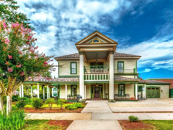 Admire the grand columns and lush greenery of this historic home, where you can experience true Southern charm and hospitality.
