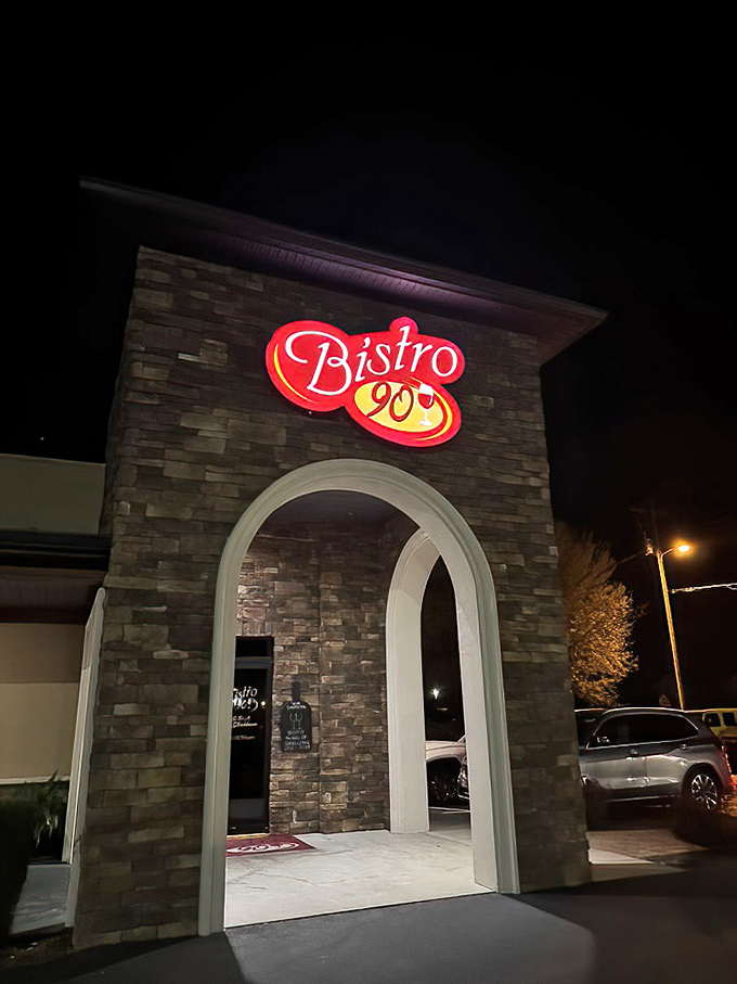 Bistro 90's dramatic stone archway entrance&mdash;like a portal to a world where calories don't count and steaks reign supreme.