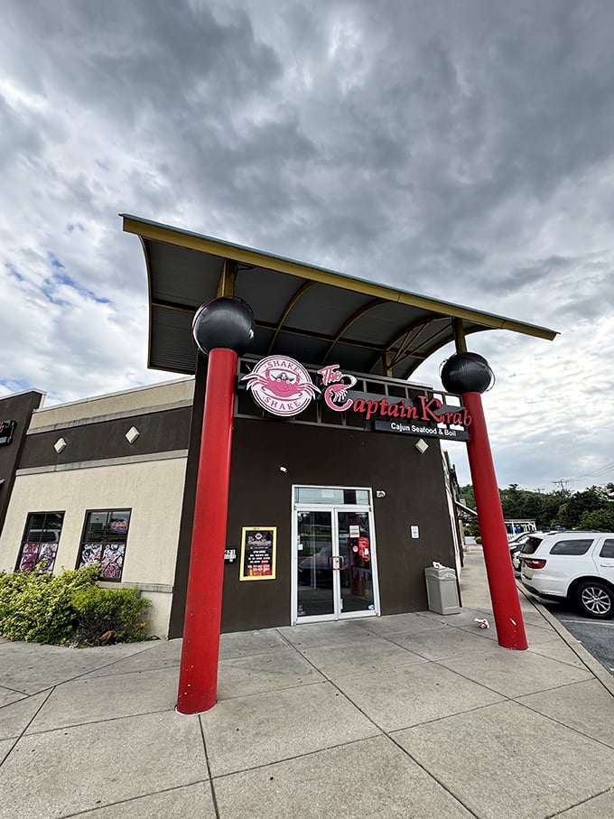 Captain Krab's bold red entrance announces itself like a carnival barker inviting you to seafood paradise.