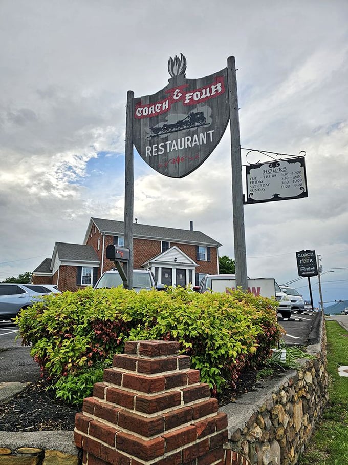 The iconic Coach & Four sign stands tall against the Virginia sky. Old-school steakhouse vibes with a side of Roanoke history.