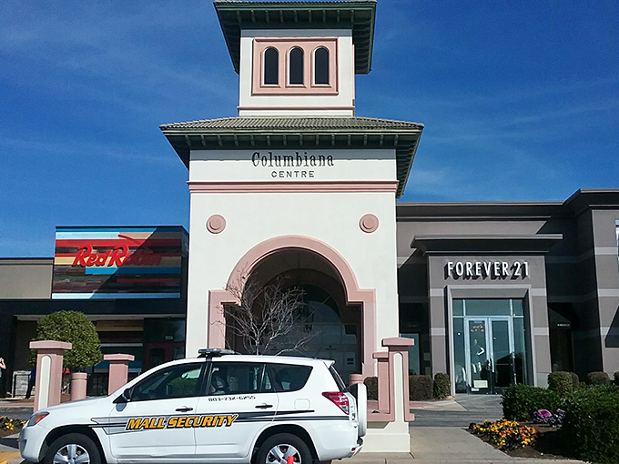 Columbiana Centre's distinctive pink-tinged tower stands like a retail lighthouse guiding shoppers to fashion's safe harbor.
