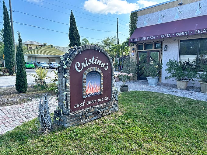 Cristino's stone archway welcomes you like the entrance to a secret pizza garden. Coal-fired perfection awaits beyond those doors!