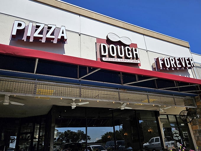 Dough Pizzeria Napoletana: "Where Neapolitan tradition meets Texas hospitality. That blue awning signals serious pizza business ahead!"