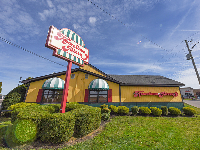 Bright yellow with striped awnings&mdash;like a pizza circus that delivers on all its delicious promises!