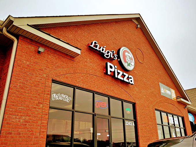 Luigi's cheerful chef logo promises exactly what you'll find inside: classic pizza craftsmanship with a friendly Italian smile.