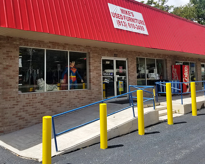 That bright red awning signals a no-frills treasure hunt where the unexpected spills right onto the sidewalk.