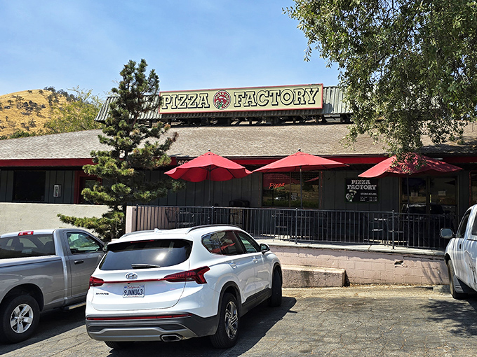 Red umbrellas welcome weary hikers to Pizza Factory's rustic retreat. After giant sequoias, only giant slices will do!