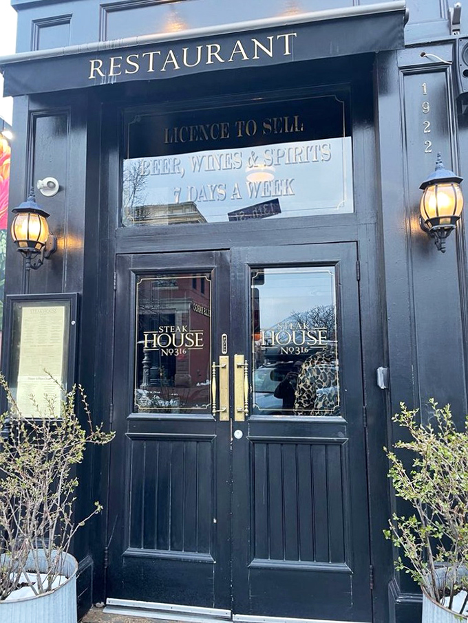 The moody exterior and golden lights of No. 316 set the stage for Boulder's most dramatic steak performance.