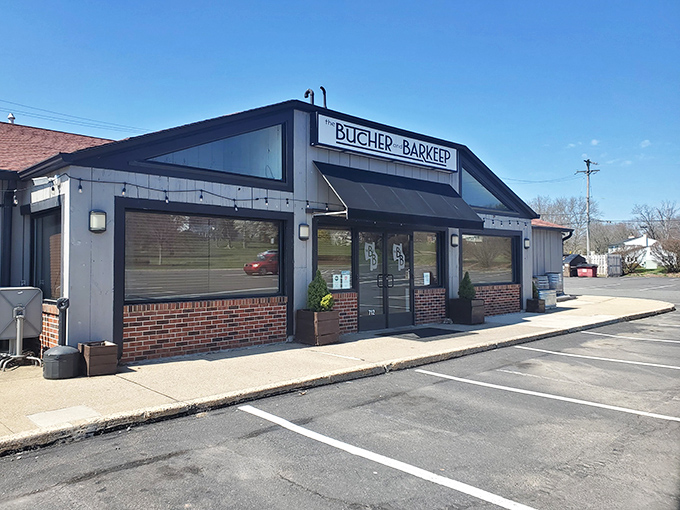 The Butcher and Barkeep's sleek gray exterior hints at the modern twist on steakhouse traditions waiting inside.
