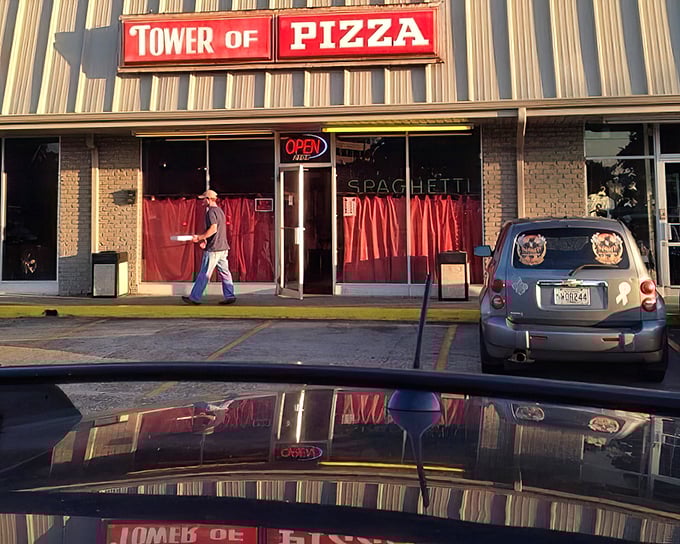Those red curtains part like the opening act of a delicious pizza performance. Simple storefront, spectacular slices.