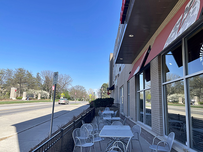 Valentino's bold red awning stands out like a pizza lover's lighthouse guiding you to flavor harbor. 