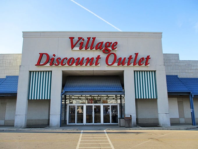 Village Discount Outlet's bold red signage practically shouts "bargains inside!" to everyone driving past.