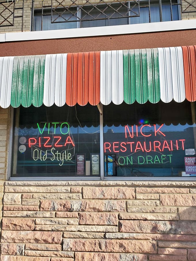 The Italian flag awning at Vito & Nick's isn't just decoration – it's a heritage statement in pizza form.