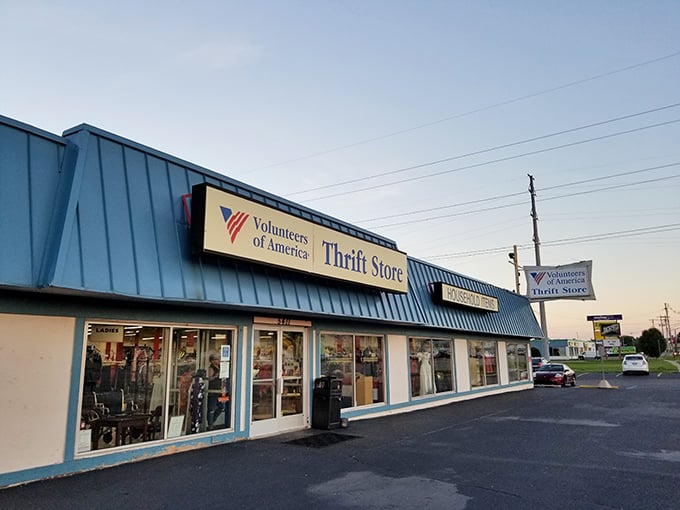 The blue-roofed Volunteers of America store glows in golden hour light&mdash;a beacon for bargain hunters as day turns to dusk.