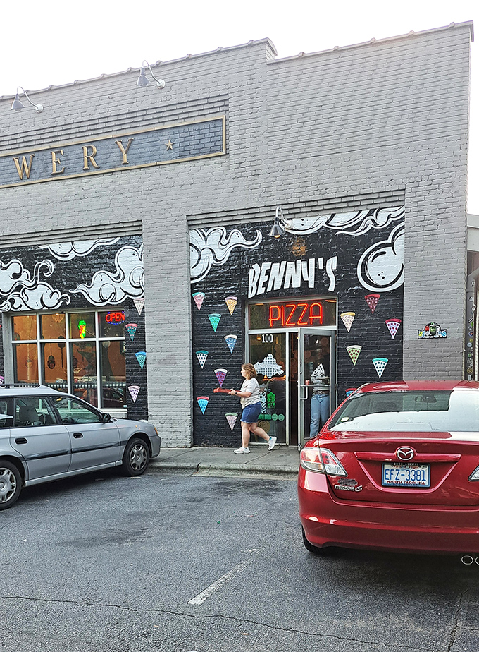 The gray building might be understated, but there's nothing subtle about the massive slices waiting inside Benny's!