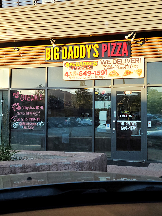 Those colorful pizza slice decals on Big Daddy's windows are practically doing a happy dance, previewing the joy inside.