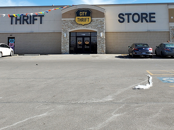 Colorful flags flutter above City Thrift's entrance, celebrating the joy of finding unexpected treasures inside.