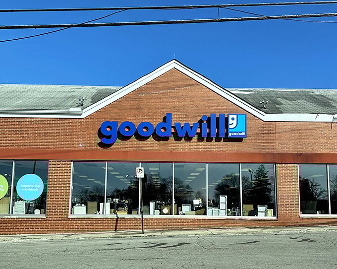 Blue sign, green mission! This familiar storefront represents both bargains for shoppers and opportunities for workers.