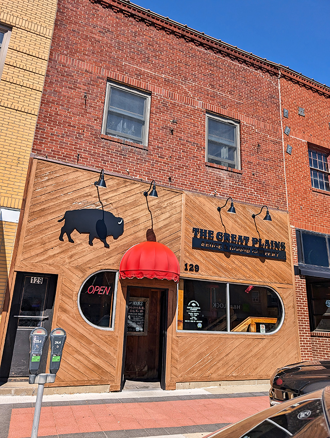 That red awning beckons like an old friend saying, "Trust me, the pizza inside will change your life."