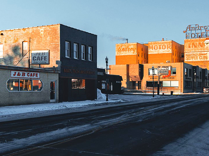 Winter settles over Hibbing's downtown, where the J&B Cafe's neon sign promises hot coffee and hometown gossip on the coldest days.
