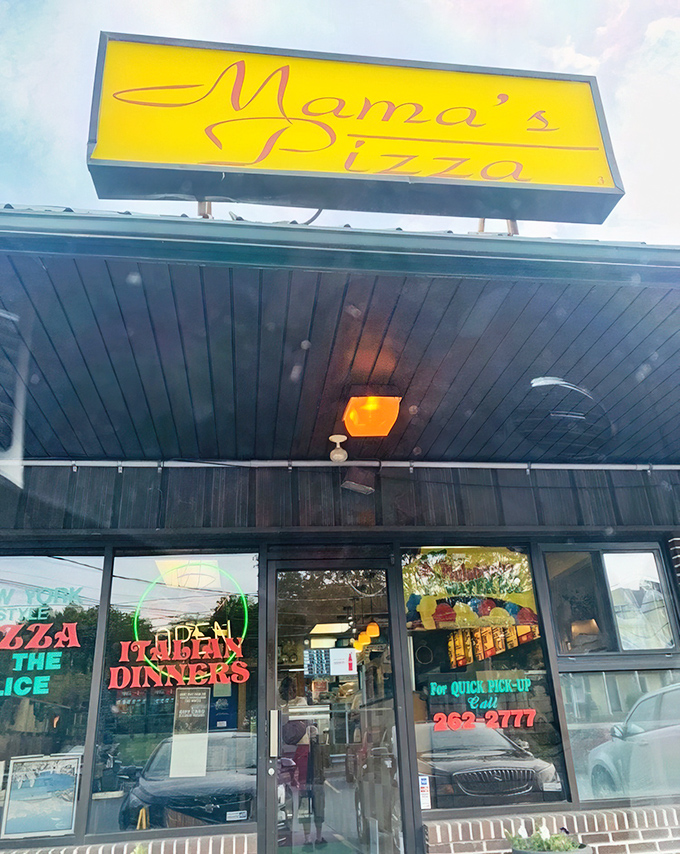 The bright yellow Mama's sign stands out like a pizza promise. Simple, straightforward, and seriously delicious.