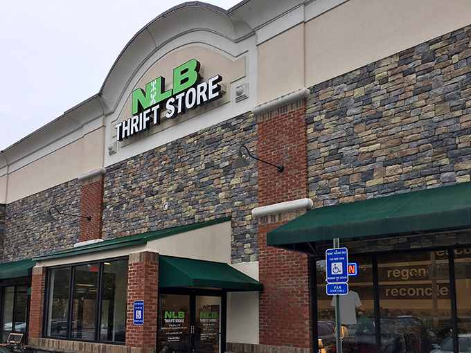 Stone facade, green awnings, and bargains galore - like shopping at a fancy boutique with yard sale prices.