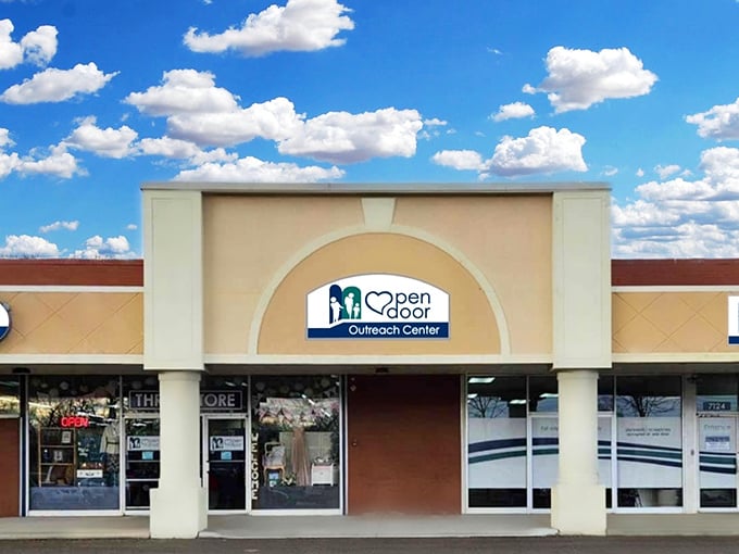 Blue skies frame this community-supporting thrift destination. Open Door Outreach Center turns your purchases into neighborhood assistance.