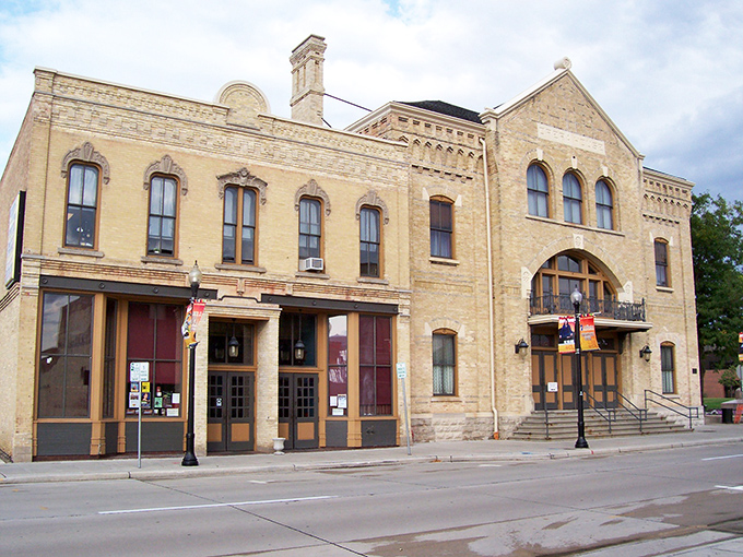 The waterfront buildings of Oshkosh stand like a welcoming committee for boaters arriving from across Lake Winnebago.