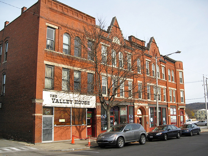 The Valley House building stands as a testament to Sayre's rich history, with its distinctive red brick fa&ccedil;ade and well-preserved architectural details from a bygone era.