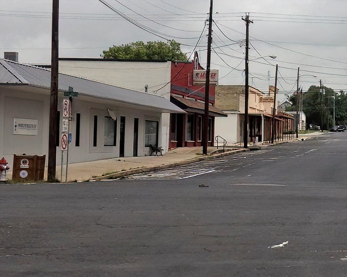 Rural Texas authenticity lives on these quiet streets where everyone still waves at strangers.