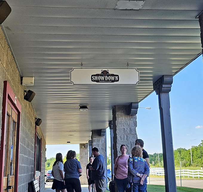 Waiting for your table at Showdown becomes part of the experience. That covered porch has hosted countless pre-dinner conversations.