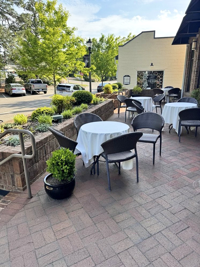 White tablecloths await on this charming patio&mdash;because great steaks deserve great surroundings and fresh air.
