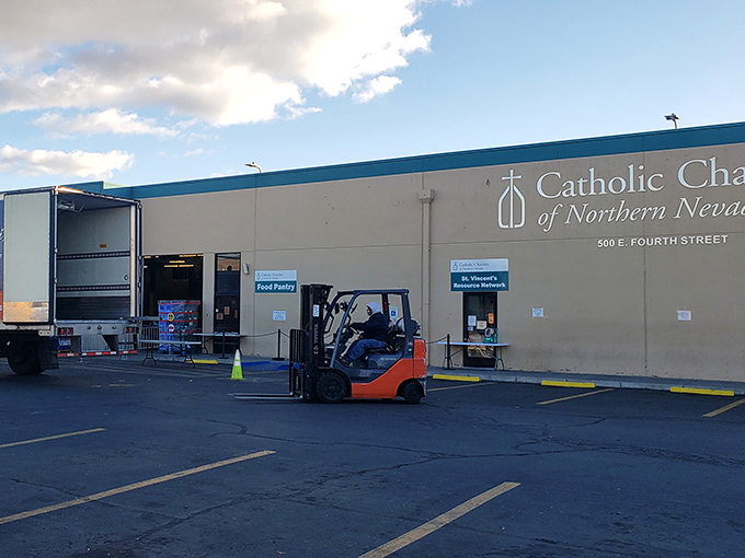 Behind those walls lies a treasure trove of second-hand finds! That forklift hints at the serious business of thrift happening here.