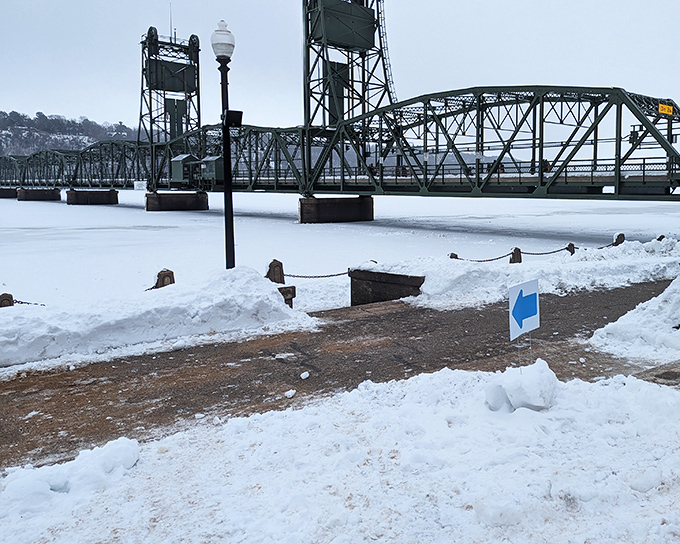 Stillwater's snow-covered bridge - where winter beauty doesn't mean your heating bill will freeze your assets.