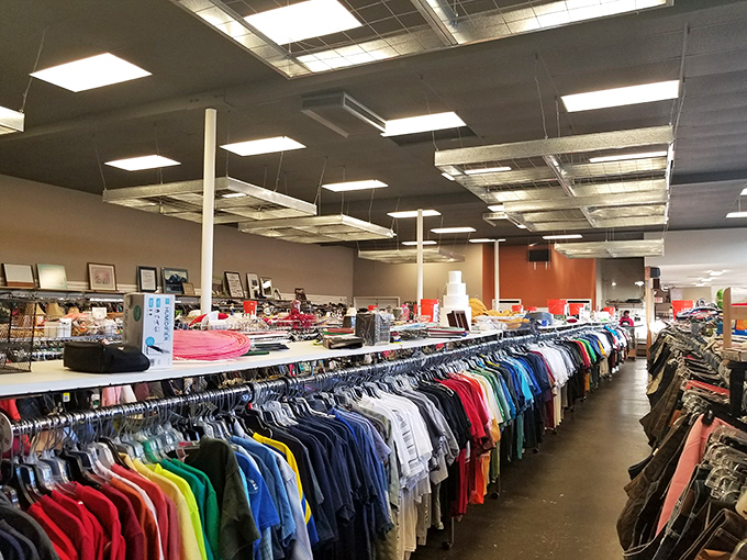 Rainbow rails of possibility! UGM's clothing section stretches toward the horizon, each hanger holding potential wardrobe magic.
