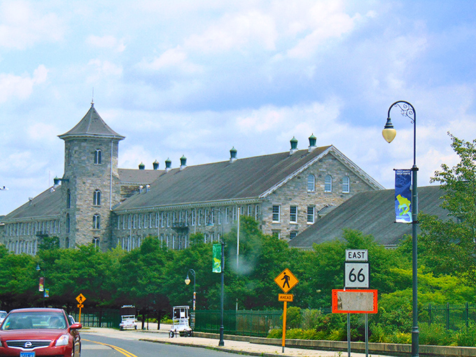 The historic stone mill building in Willimantic stands as a monument to Connecticut's industrial past, now reimagined for modern living.