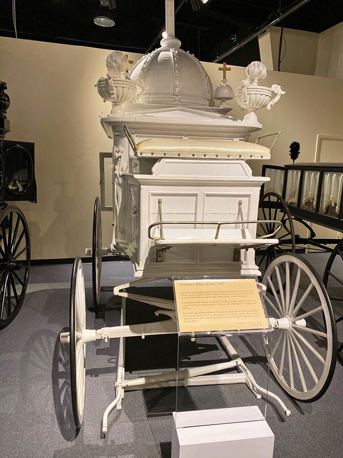 This ornate 1900 children's hearse, with its angelic details and pristine white finish, tells a poignant story about Victorian-era mourning traditions.