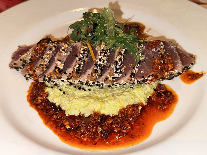Sesame-crusted ahi tuna resting on a vibrant bed of flavor &ndash; proof that Smack Shack's talents extend well beyond the lobster realm.