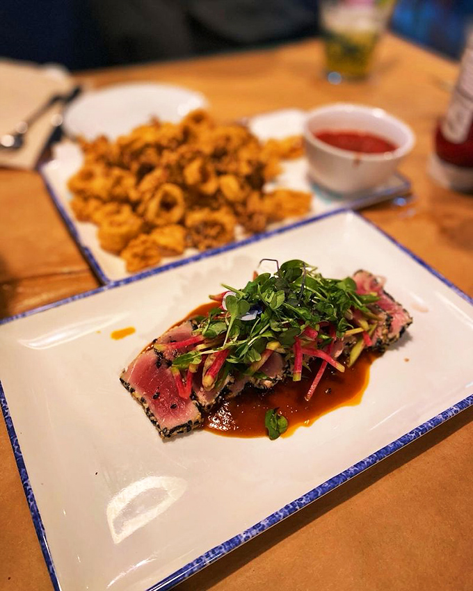 Seared ahi tuna dressed for success with a colorful microgreen hat. Ocean elegance that doesn't need to show off.