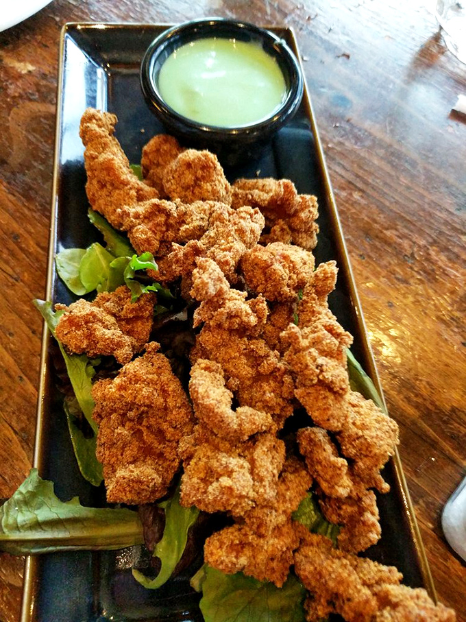 Alligator bites: the conversation starter on every table. Crispy, tender, and the perfect excuse to tell that fishing story nobody believes anyway.