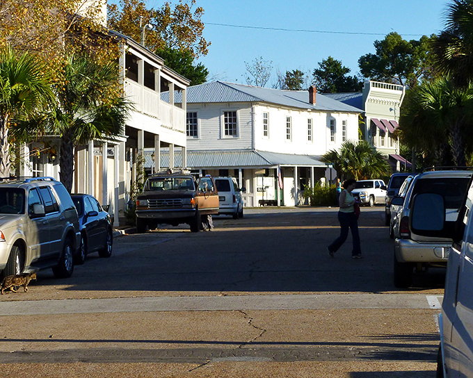 Historic buildings line Apalachicola's streets, where time moves slower and conversations with strangers often turn into friendships by dessert.