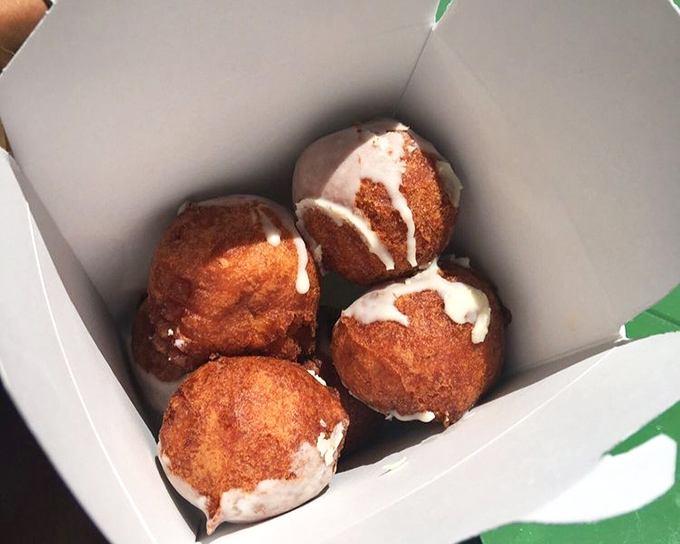 Apple fritters that look like they were sent from the heavens - crispy, sweet orbs of fried perfection drizzled with icing.