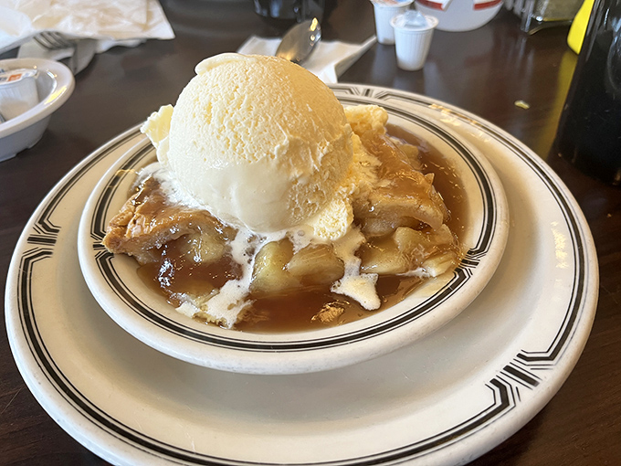 Warm apple pie crowned with a scoop of vanilla ice cream. The classic American dessert that makes you wonder why anyone bothers with trendy sweets.