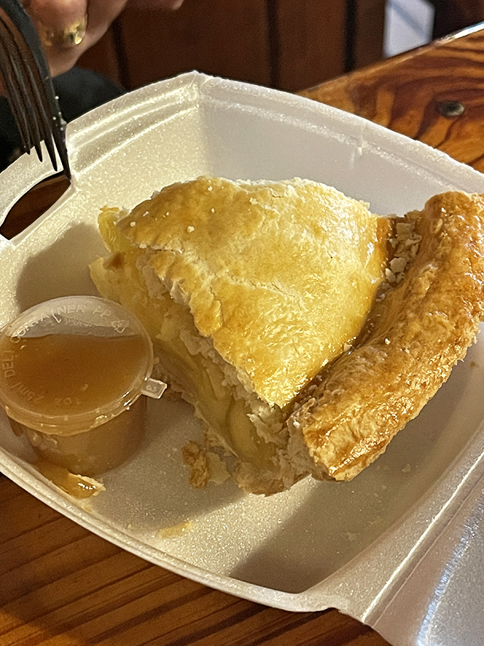 Homemade apple pie that doesn't need Instagram filters—just a little container of syrup for those who like to gild the lily.