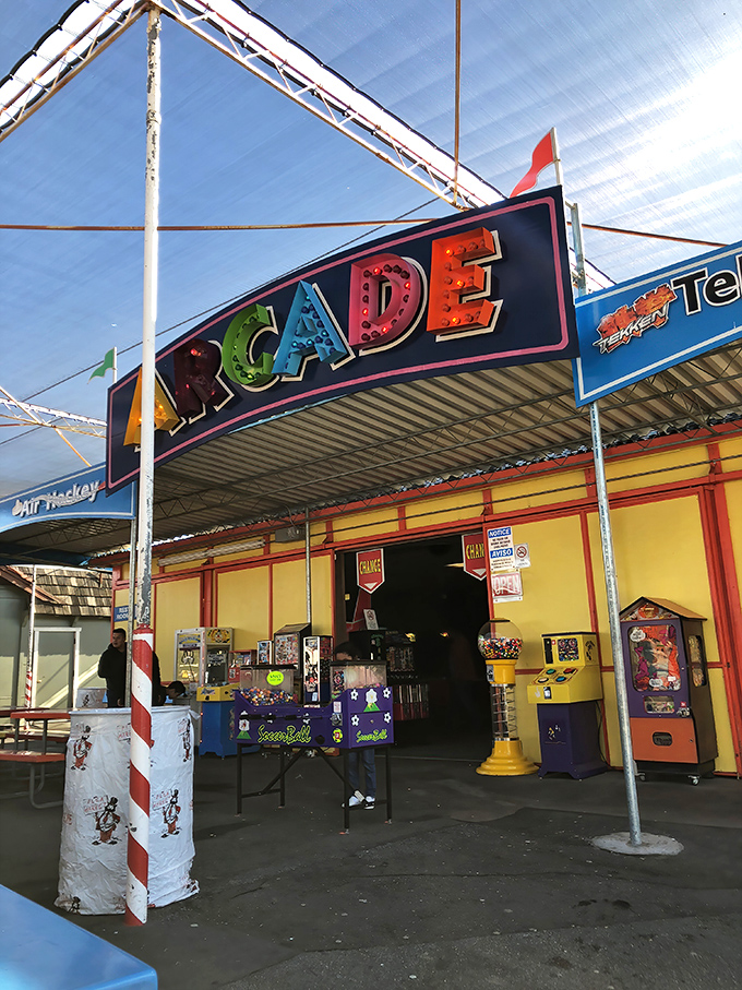 The neon ARCADE sign promises a time-travel trip to the '80s, when quarters were currency and high scores were bragging rights.
