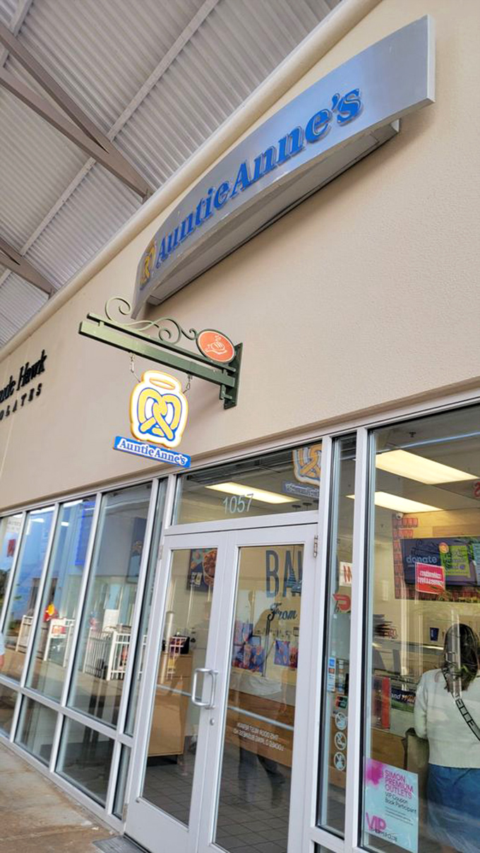 The unmistakable aroma of Auntie Anne's pretzels wafts through the walkway &ndash; the unofficial perfume of American malls since 1988.