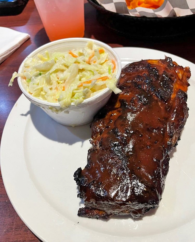 Ribs so tender they practically surrender to your fork, with a side of coleslaw that's not an afterthought.